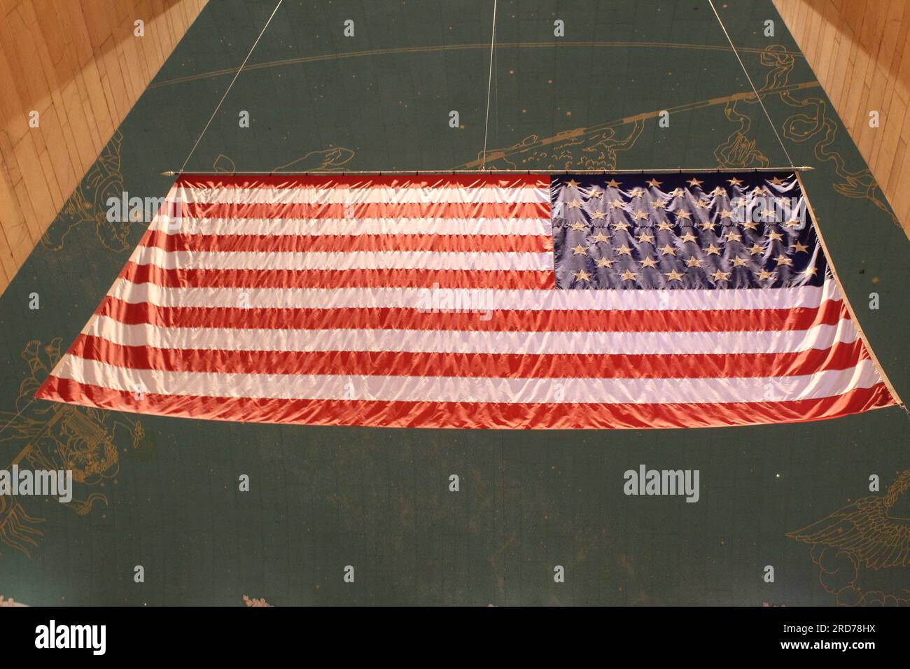 A photo of the American flag hanging from the roof of a train station ...