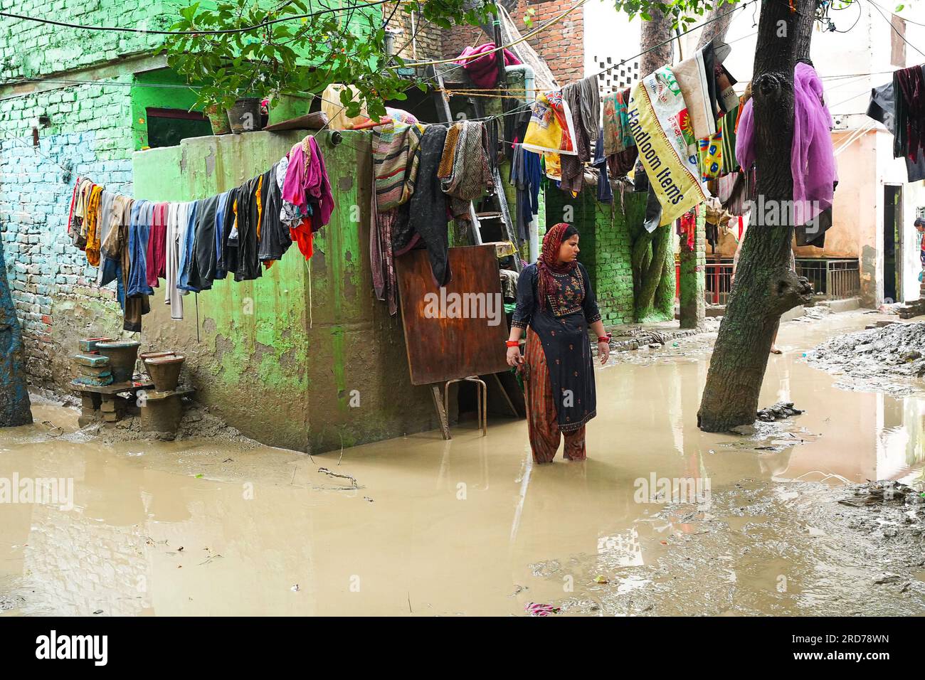 New Delhi, New Delhi, India. 18th July, 2023. A woman stand outside her ...