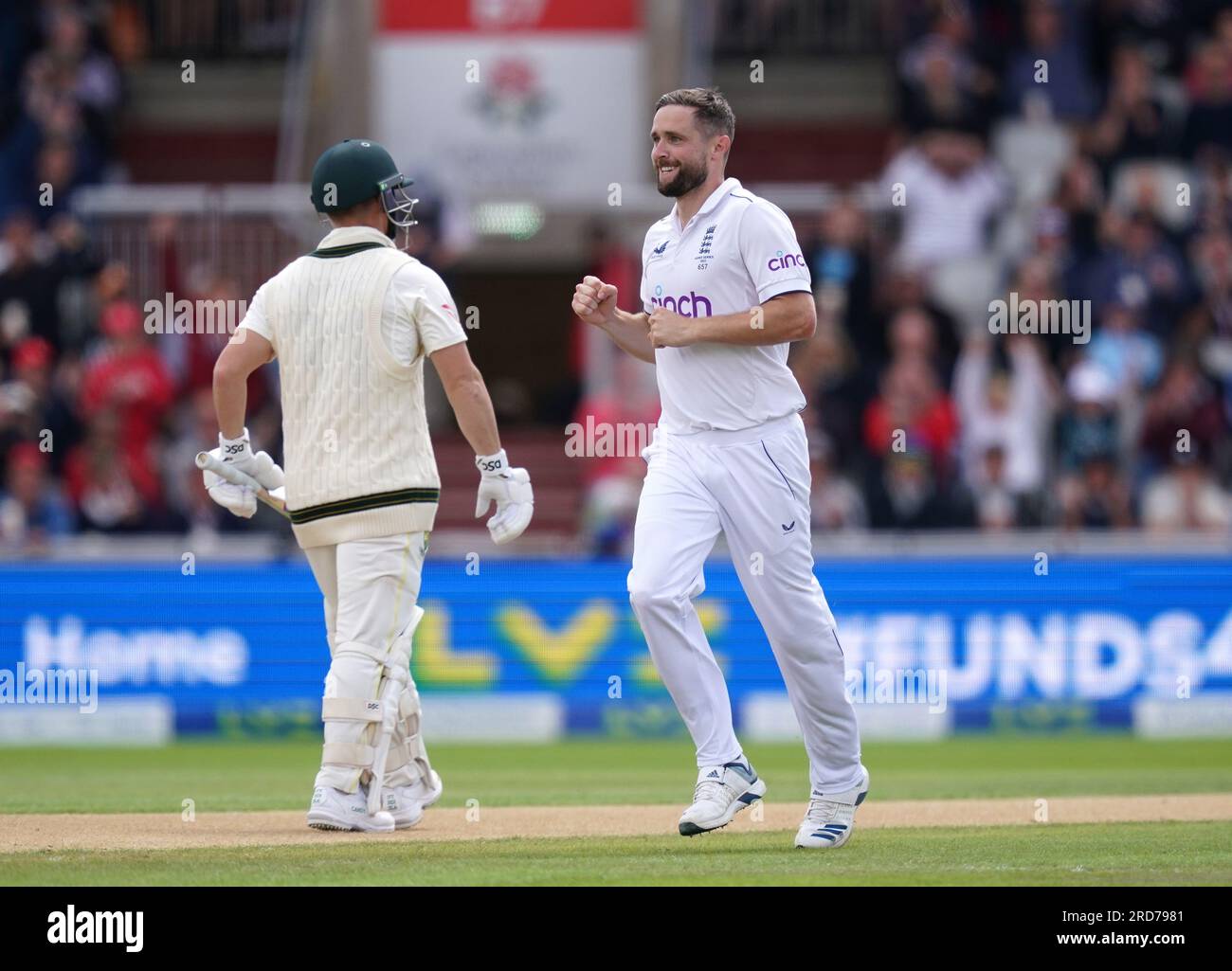 England's Chris Woakes celebrates after taking the wicket of Australia ...