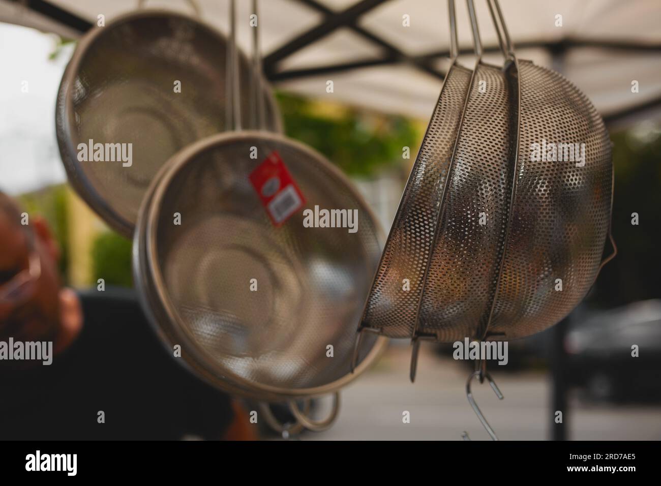 Sale of cups and utensils in the street market Stock Photo - Alamy