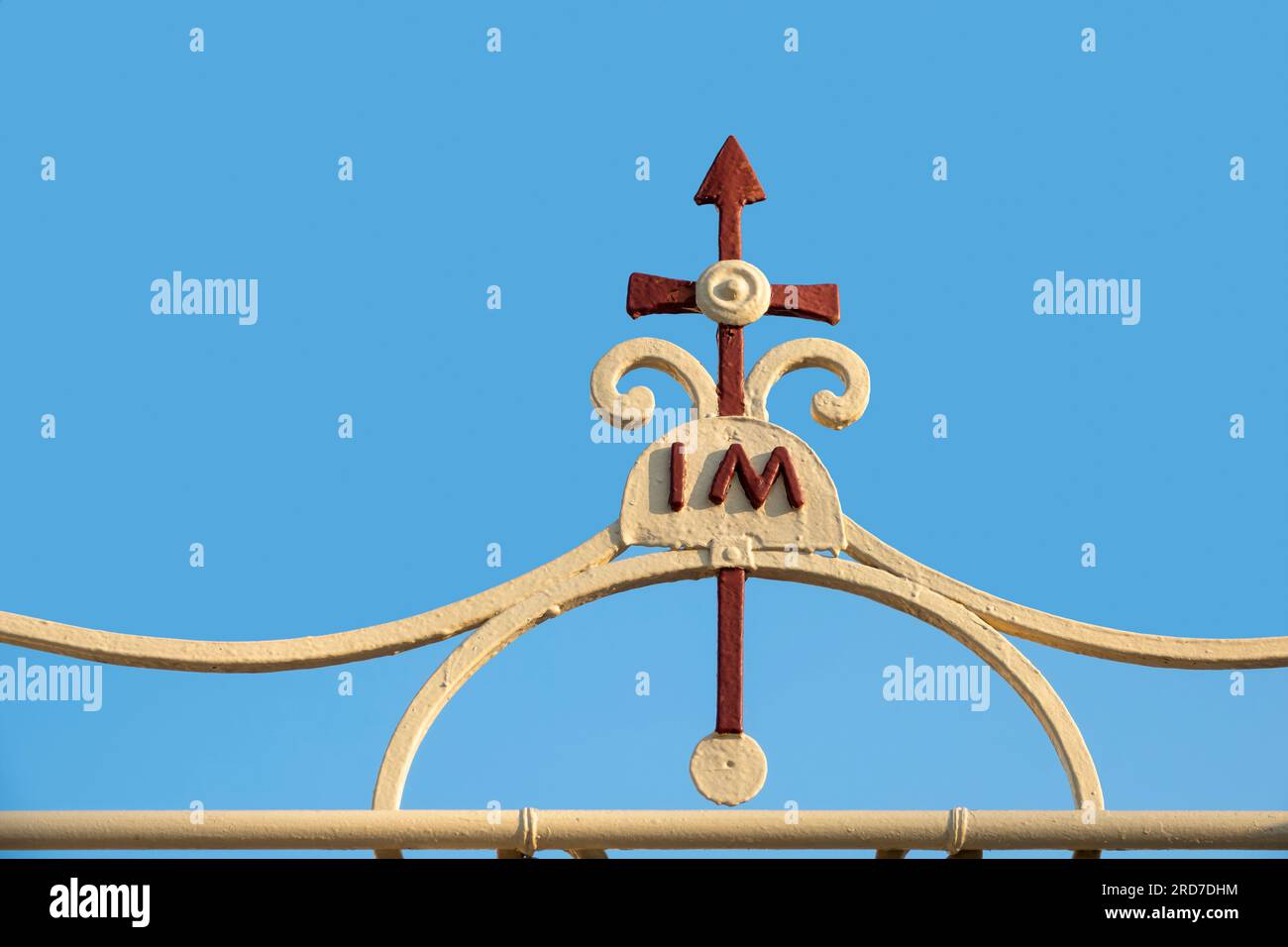 Wrought iron and painted steel church gate with decorative cross Stock ...