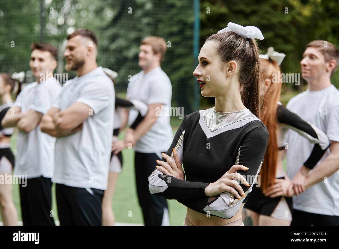 Young cheerleading girl taking part in performance together with her ...