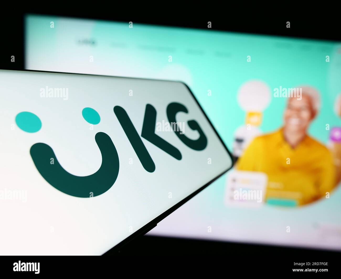 Mobile phone with logo of US software company Ultimate Kronos Group ...