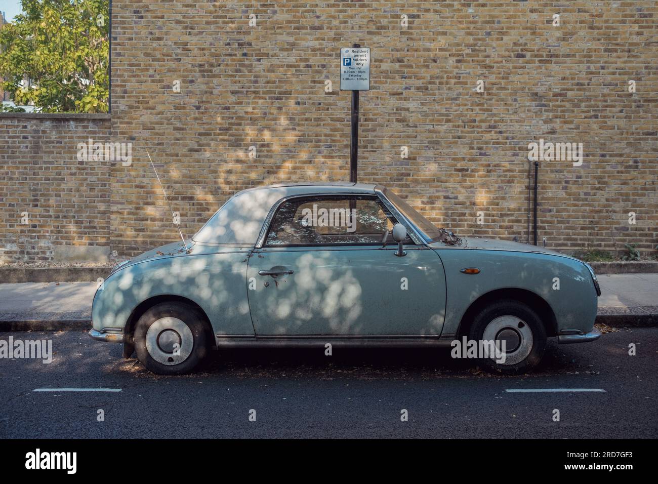 Blue green Nissan Figaro car parked outside in Notting Hill London in ...