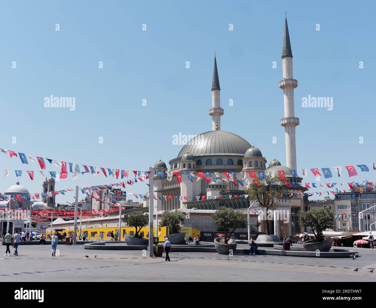 Taksim Square criss crossed by bunting and Taksim Mosque on a summers ...