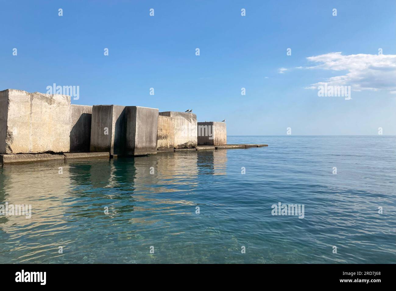 concept serenity view of sea, concrete cubes and seagulls Stock Photo ...
