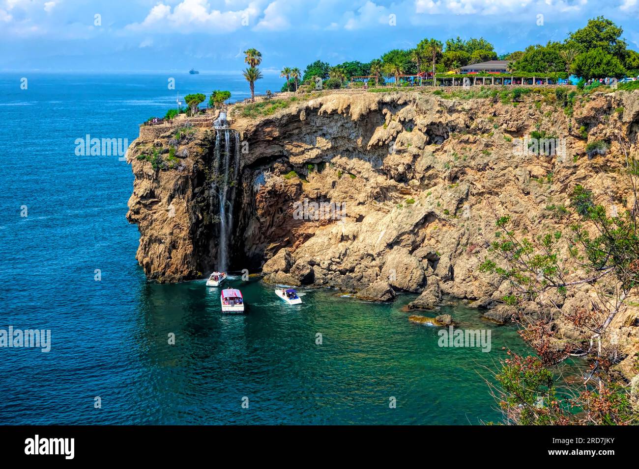 Coast waterfall and boats Antalya Turkey with beautiful blue ...