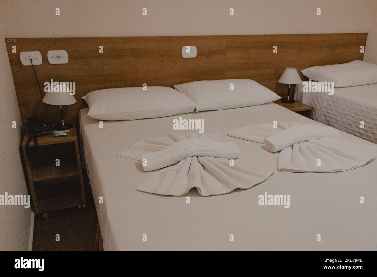 simple hotel bed Stock Photo - Alamy