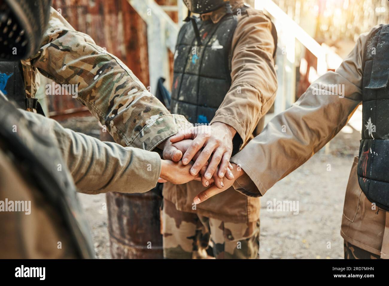 Paintball, team and hands together for meeting in huddle, motivation or ...