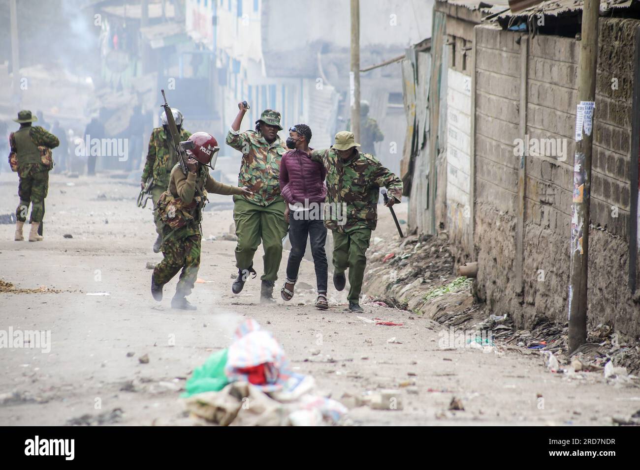 Nairobi, Kenya. 19th July, 2023. Police officers arrest a protester ...