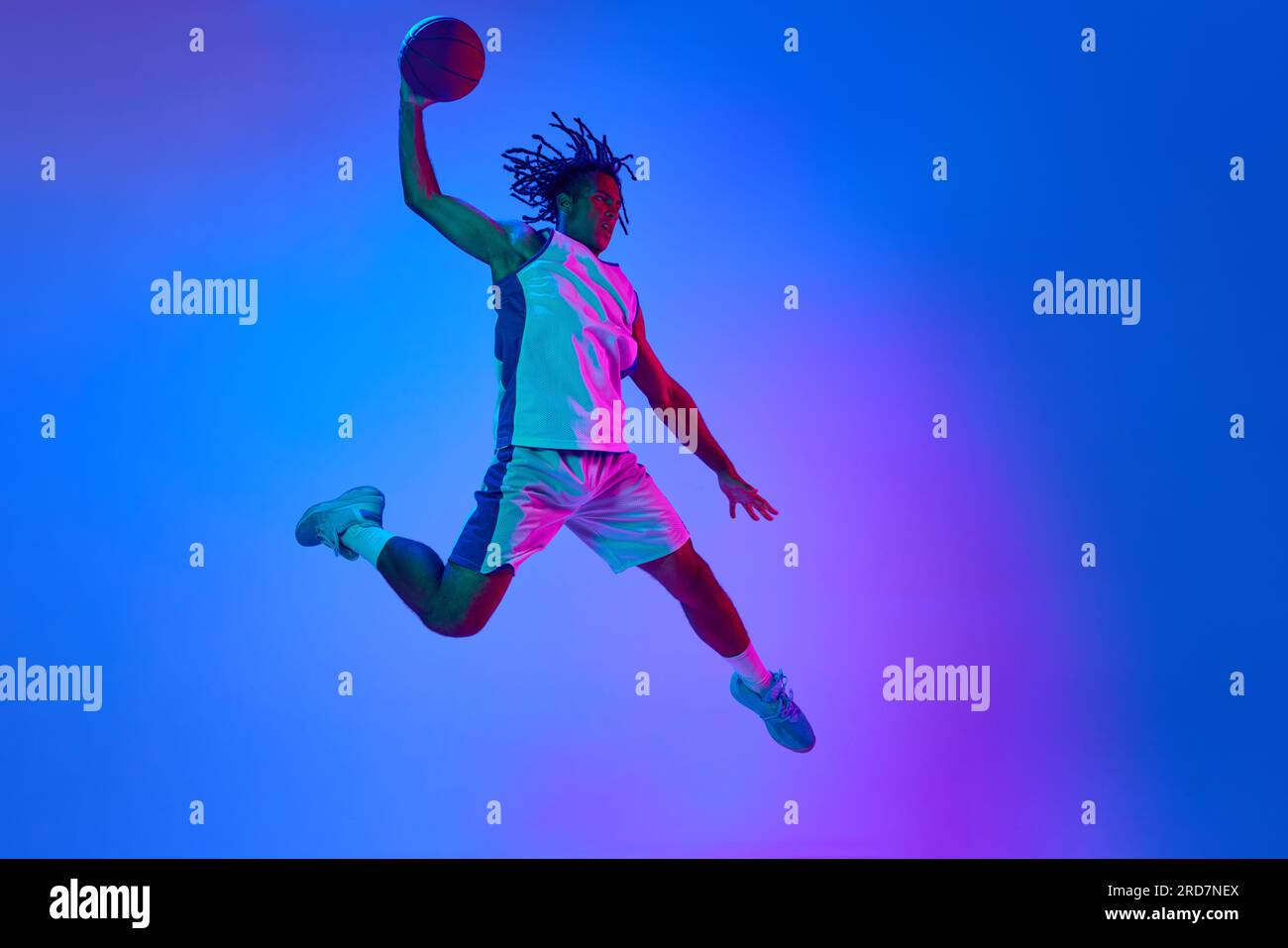 Competitive, ambitious sportsman, young basketball player in motion ...