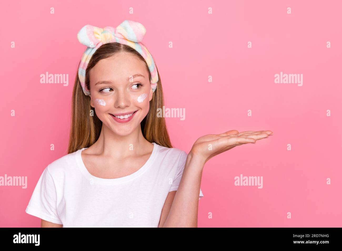Photo of wellbeing cute girl look arm palm hold demonstrate empty space ...