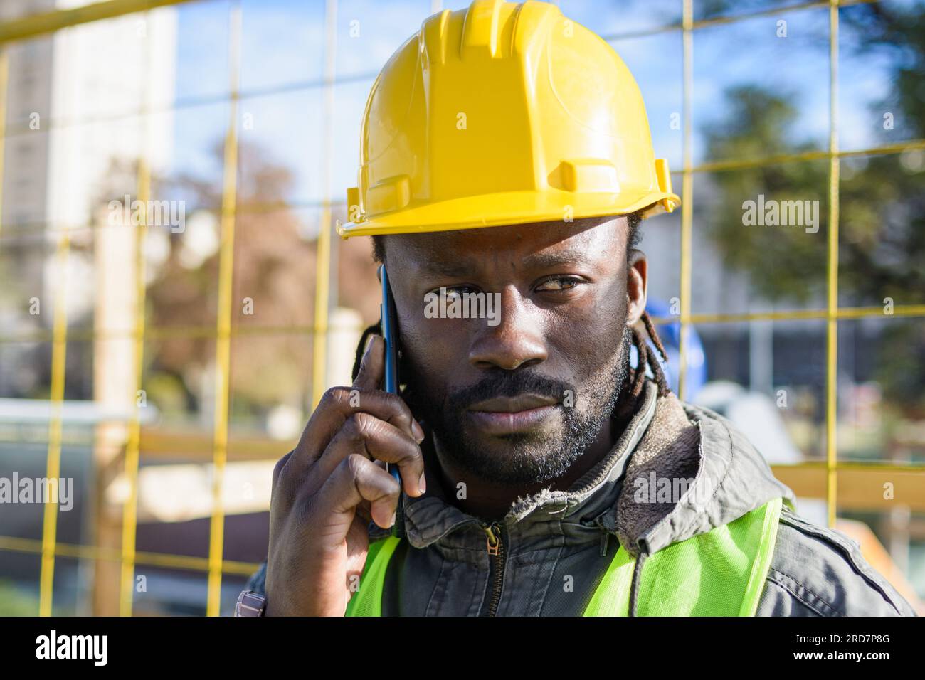 young black male builder employee wearing yellow safety helmet ...
