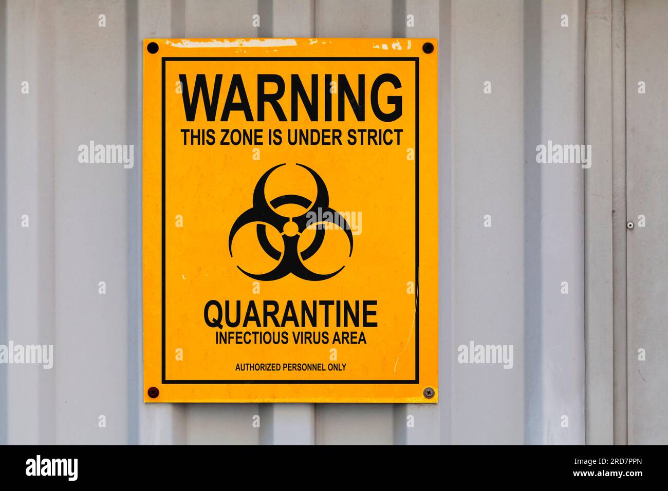 Warning sign drawn on a black and yellow placard with written in ...