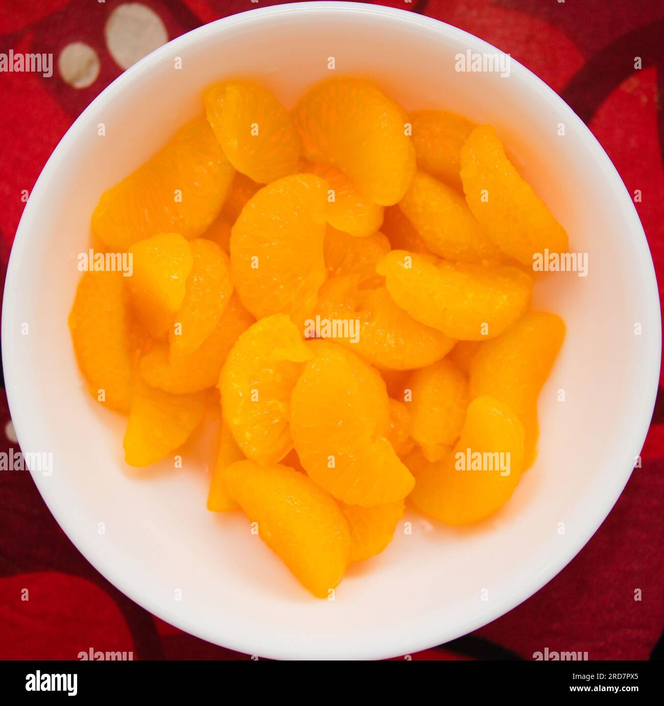 Overhead view of mandarin orange segments in a white bowl Stock Photo ...