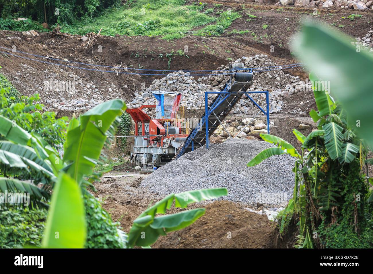 Malepunyo Mountains Range, Philippines. July 19, 2023 : Mobile Stone Jaw crusher quarrying in ...