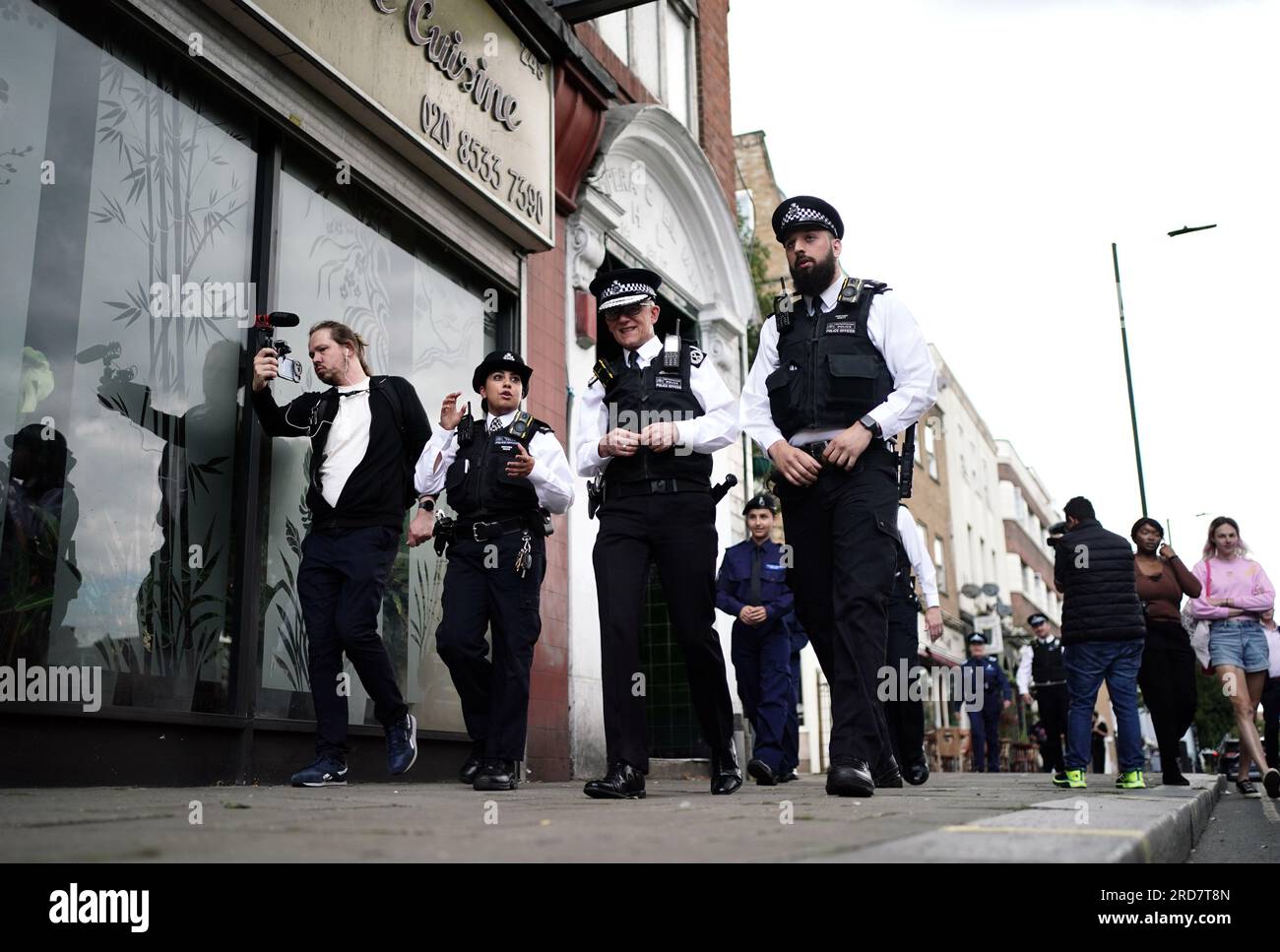 Metropolitan Police Commissioner Sir Mark Rowley (centre) in Hackney ...