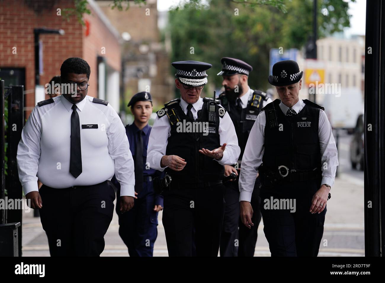 Metropolitan Police Commissioner Sir Mark Rowley (centre) in Hackney ...