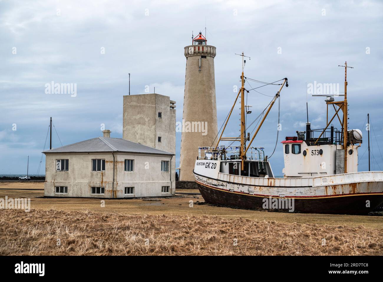 The new Garðskagi lighthouse and old shipwreck near the village of ...