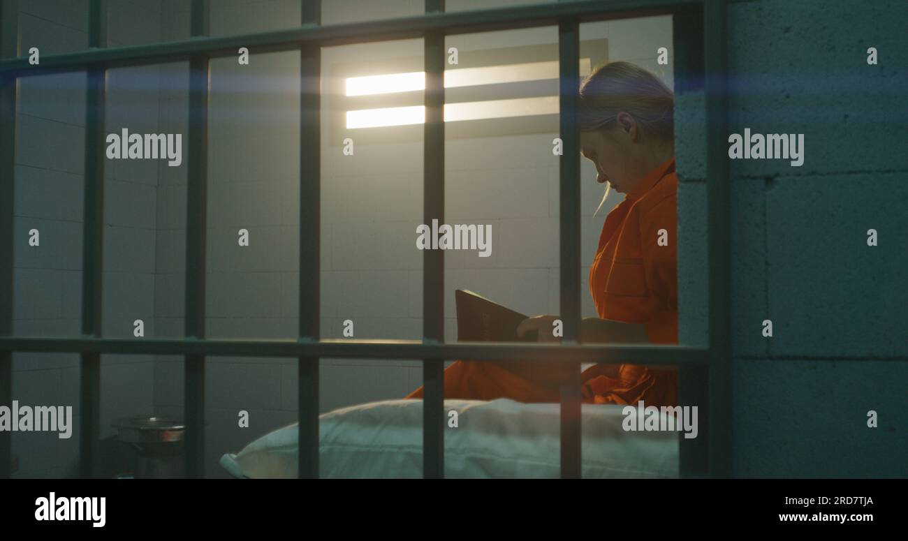 Female inmate sits in her prison cell hi-res stock photography and ...