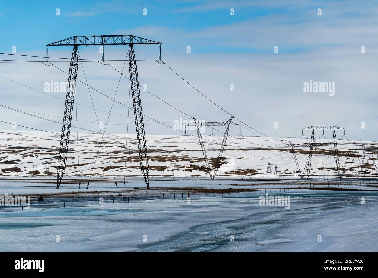 Three of the typical Icelandic transmission towers in a frosty winter ...