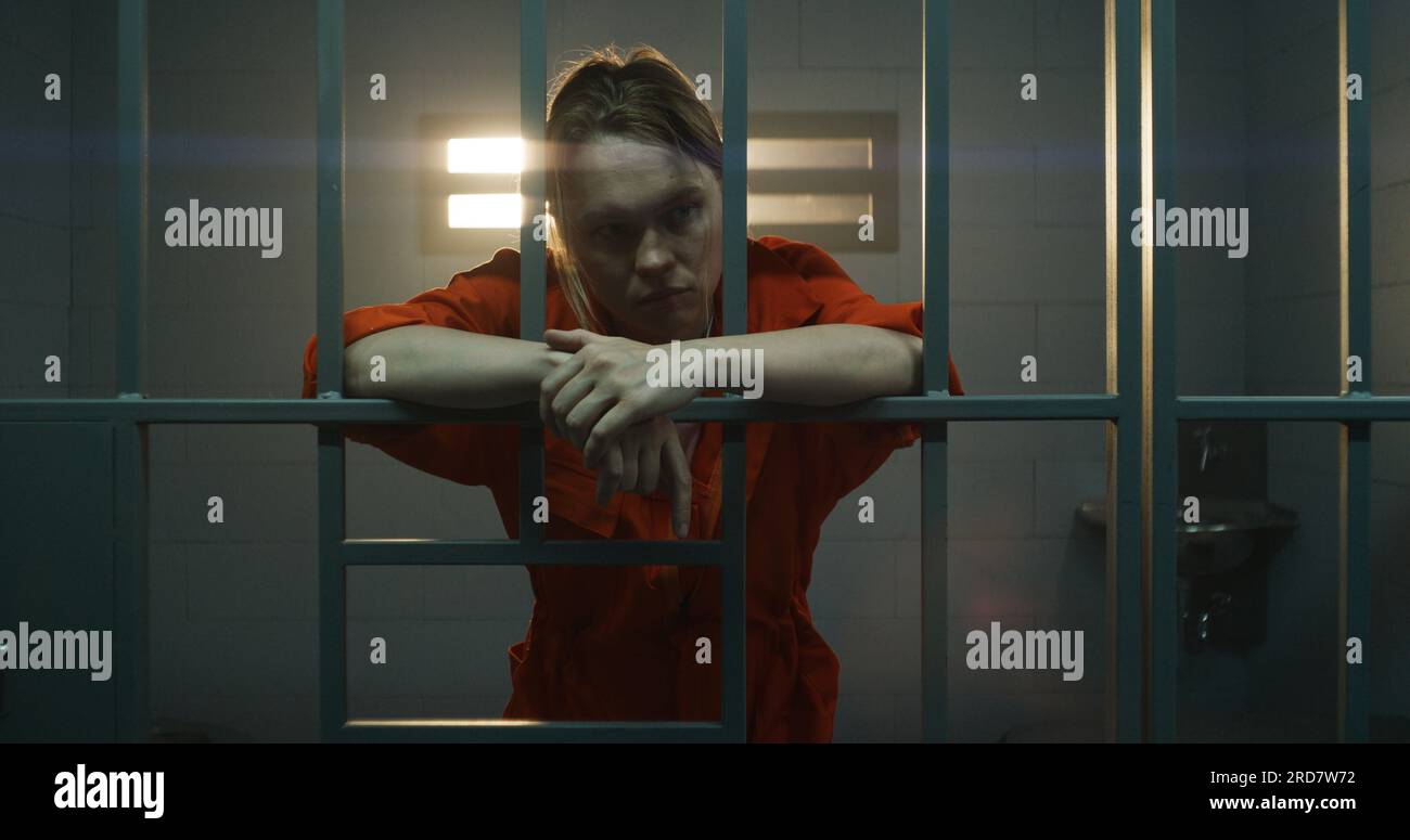 Woman inmate bars hi-res stock photography and images - Alamy