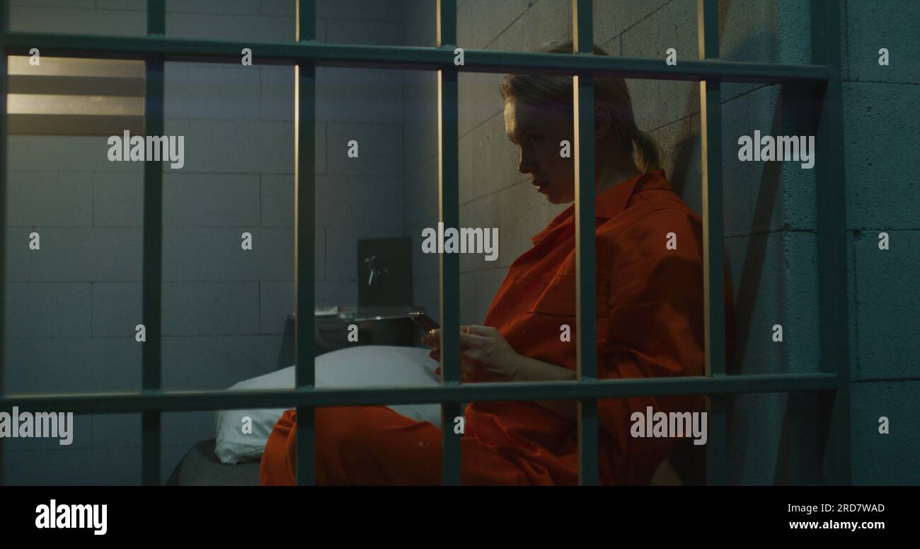Female prisoner using smartphone hi-res stock photography and images ...