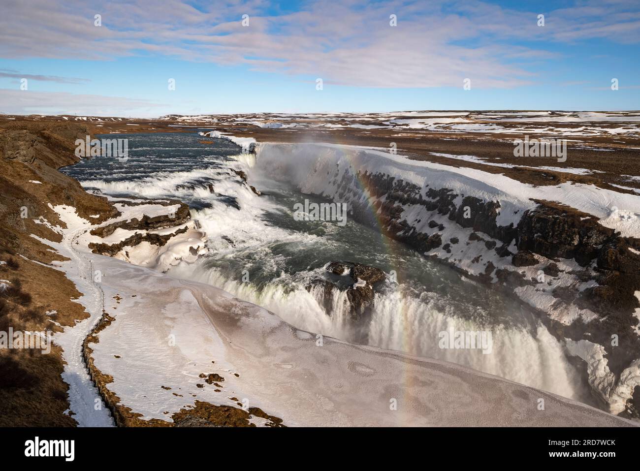 The mighty Gullfoss waterfall in a beautiful late winter scenery ...