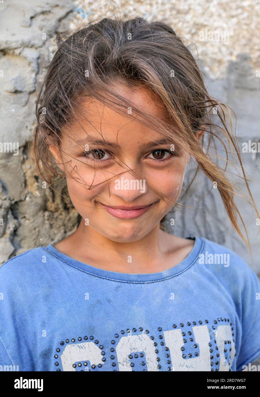 A Palestinian girl poses as she plays near her family's home in the ...