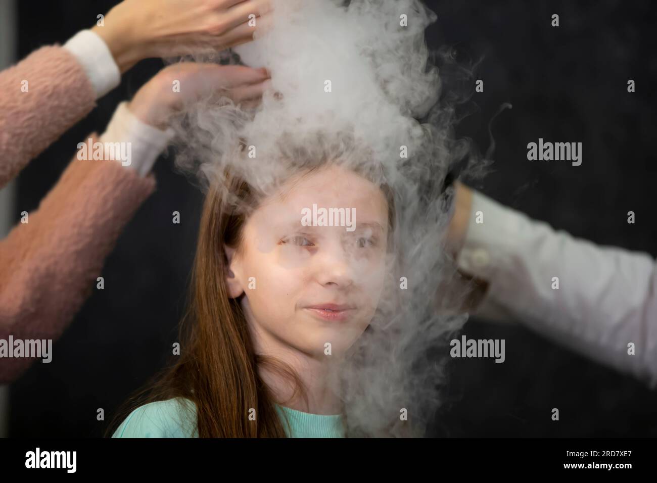 The child is a participant in scientific experiments. Girl in liquid ...