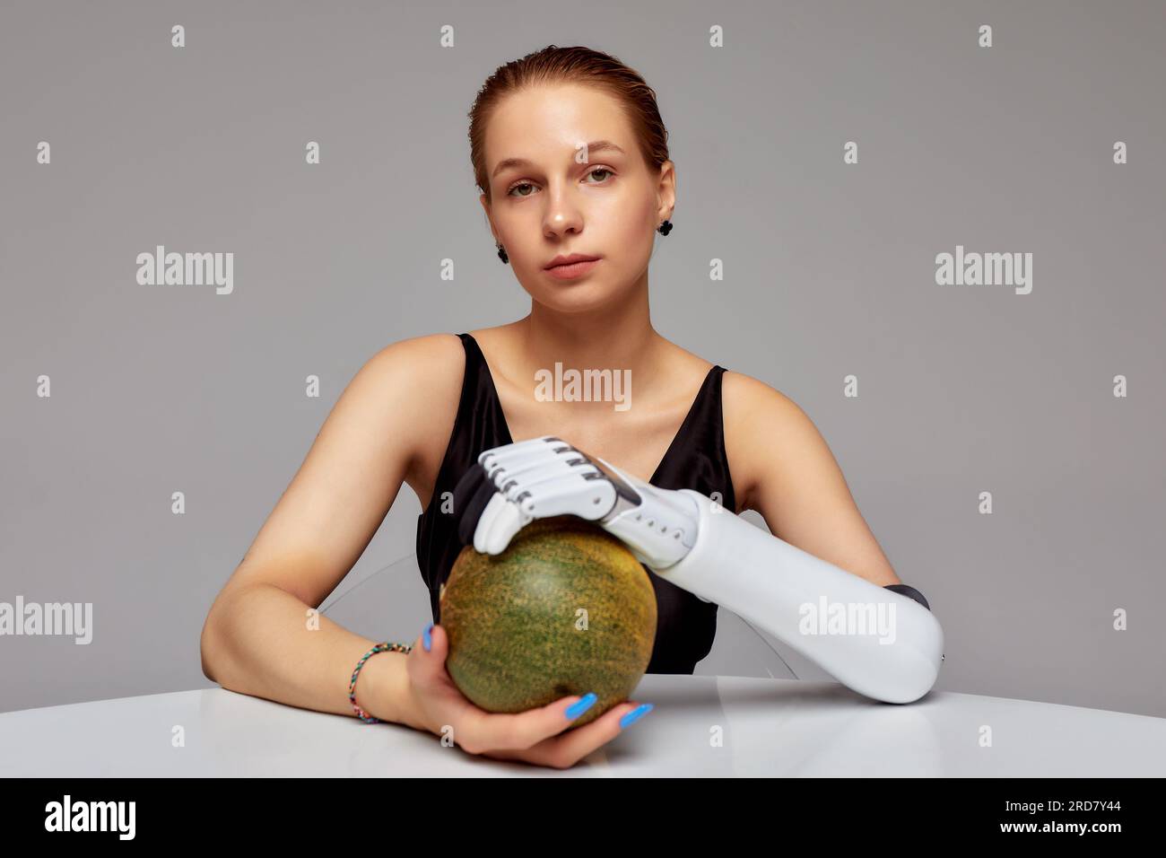 Young charming girl with disability wearing sensory bionic prosthetic ...