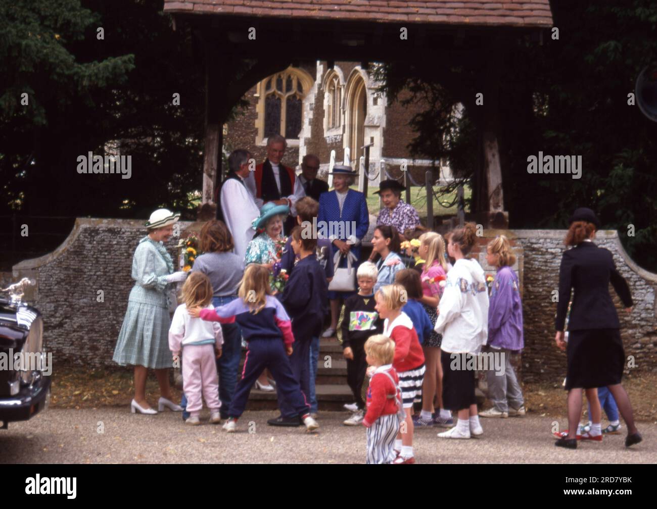The Queen and Queen Mother greeting children at Sandringham Church on ...