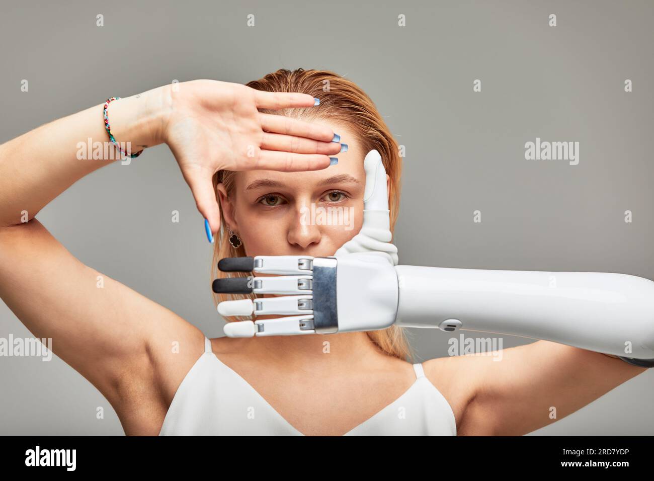 Studio portrait of a young girl with disability wearing sensory bionic ...
