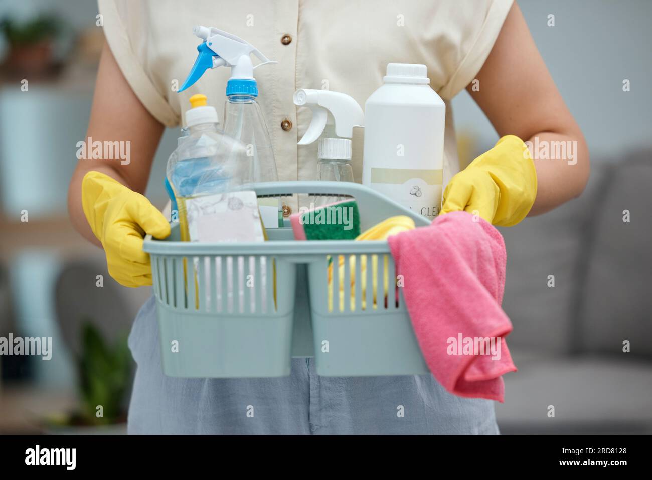 Woman, hands and detergent basket for cleaning, housekeeping or ...