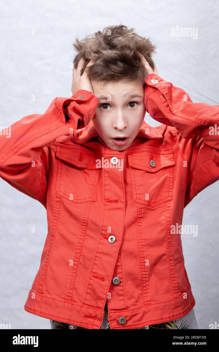 Wow. Studio shot of emotional adorable little boy raising eyebrows ...