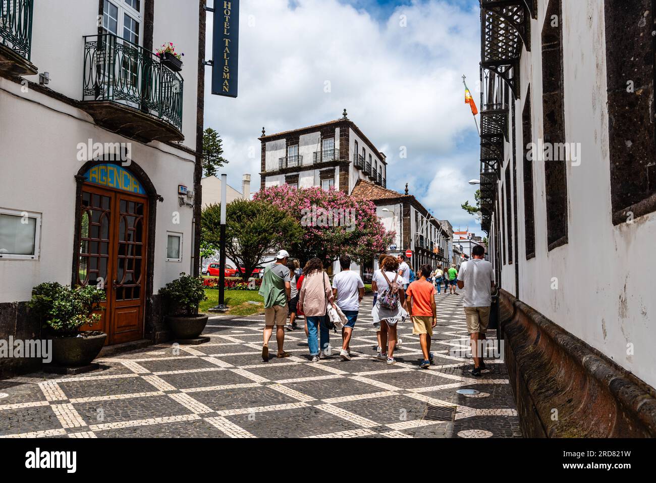 Ponta Delgada, Portugal - July 9, 2023: People walking by pedestrian ...
