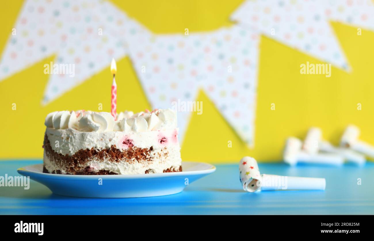 Festive birthday cake. Cake with a candle. Cake on a festive background ...