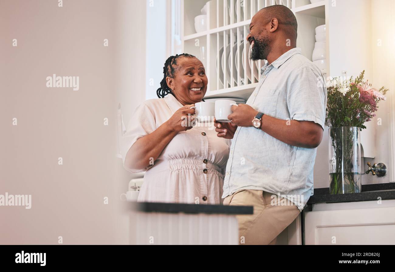 Coffee, happy and a talking black couple in the kitchen, laughing and ...