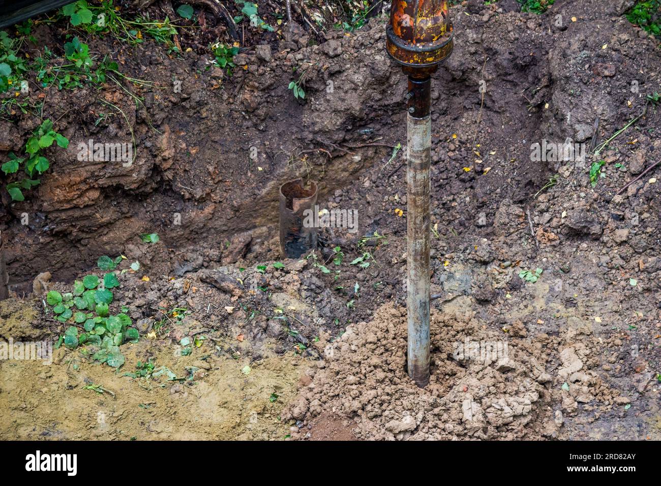 Drilling a well in the ground Stock Photo - Alamy