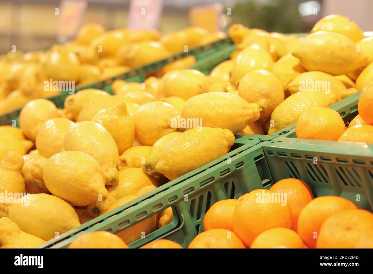 Sale of lemons in the supermarket. Citrus fruits in plastic boxes ...