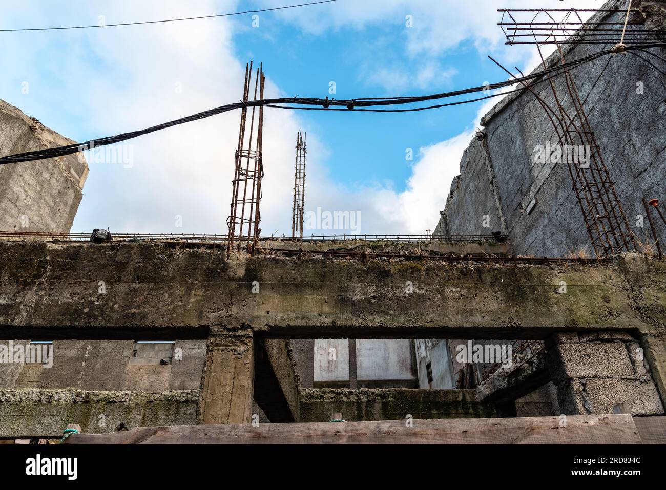 Abandoned reinforced concrete structure showing the effects of ...