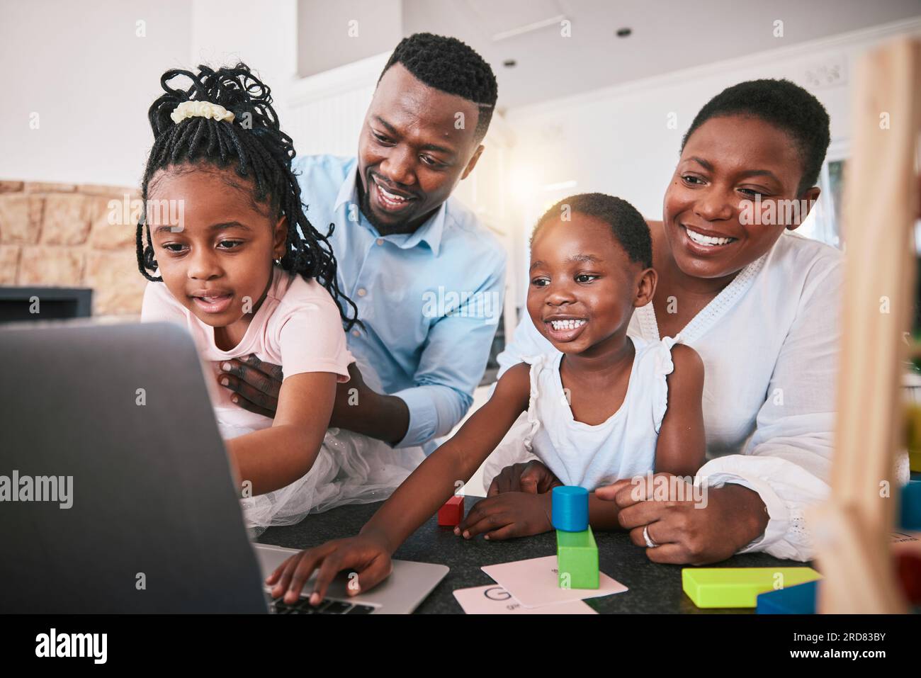 Black family, laptop and elearning, education and happiness, parents help children with school ...