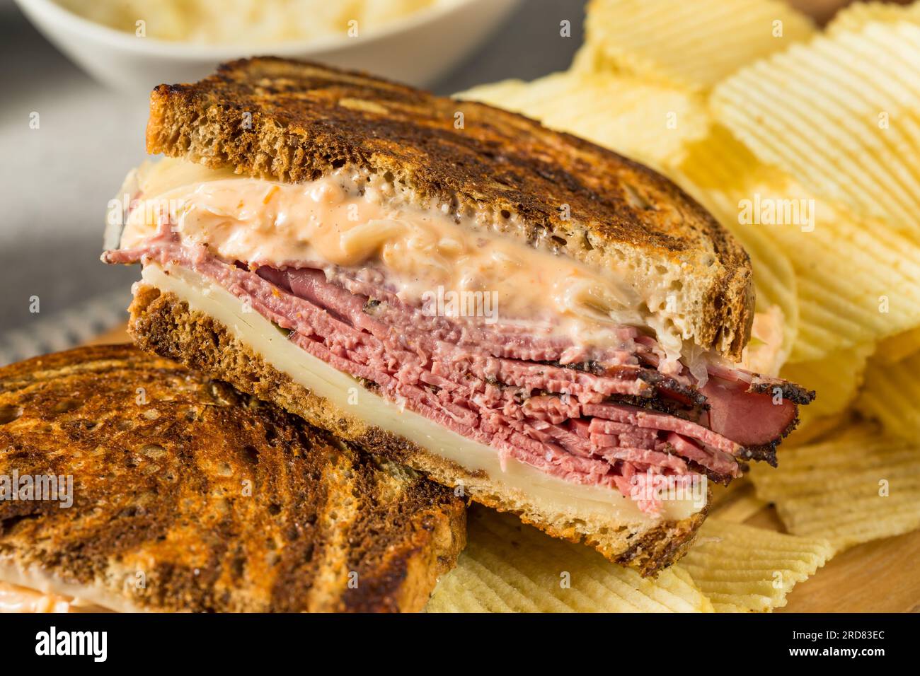 Homemade Russian Reuben Sandwich with Cheese and Chips Stock Photo - Alamy