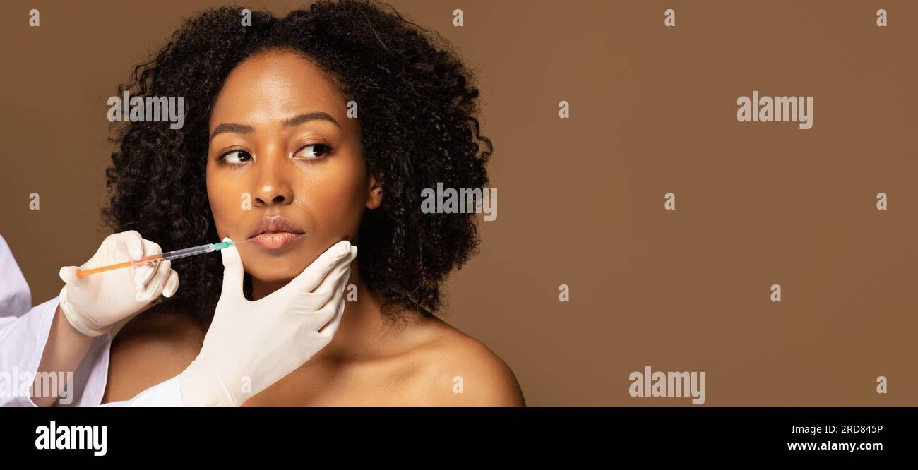 Hot young black woman get lip filler injection, web-banner Stock Photo ...