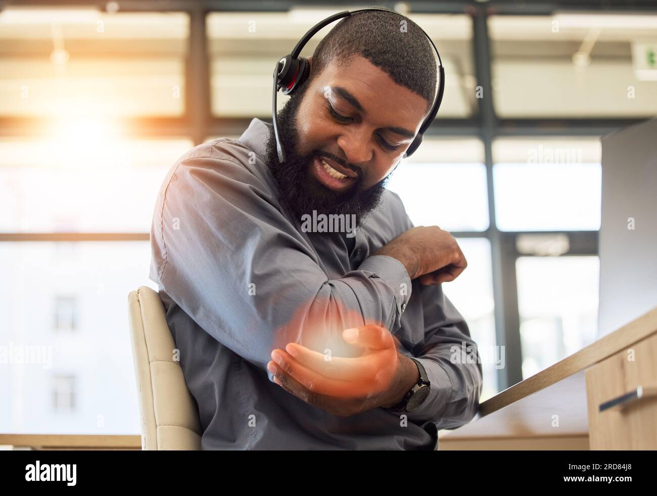 Black man, elbow pain and working in call center, injury and sick with ...