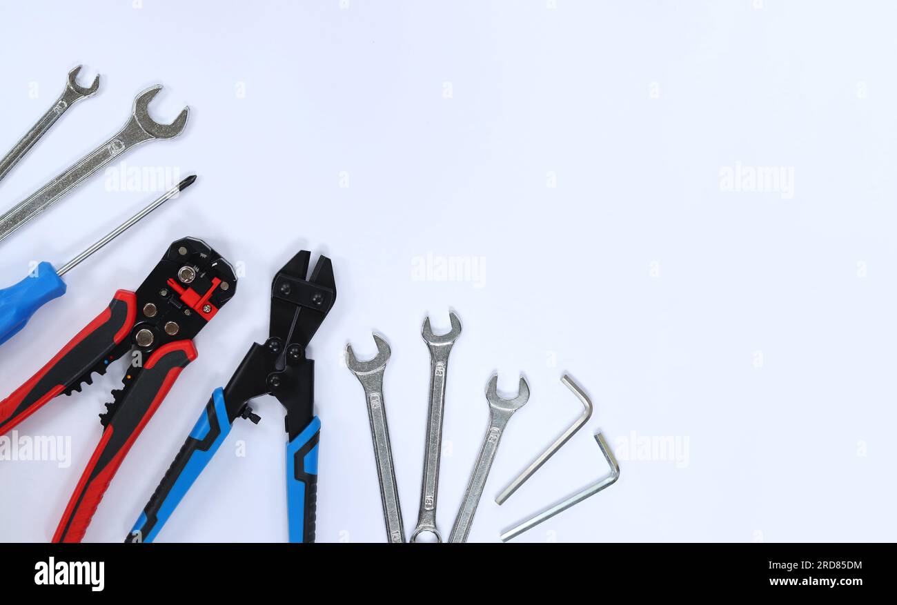 Repair tools on a white background, top view. Bolt cutter, wire ...