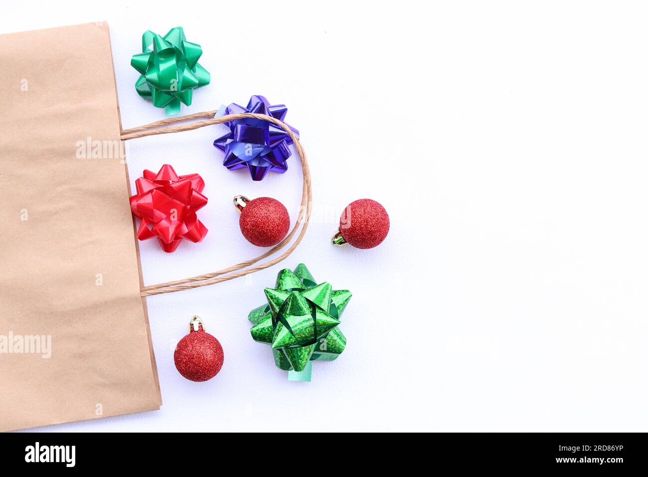 Christmas background with items falling out of a paper bag, top view ...