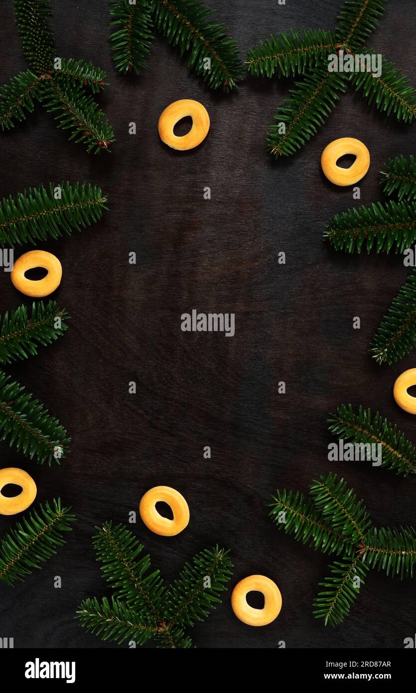 Branches of Korean fir on the background of a wooden table, top view ...