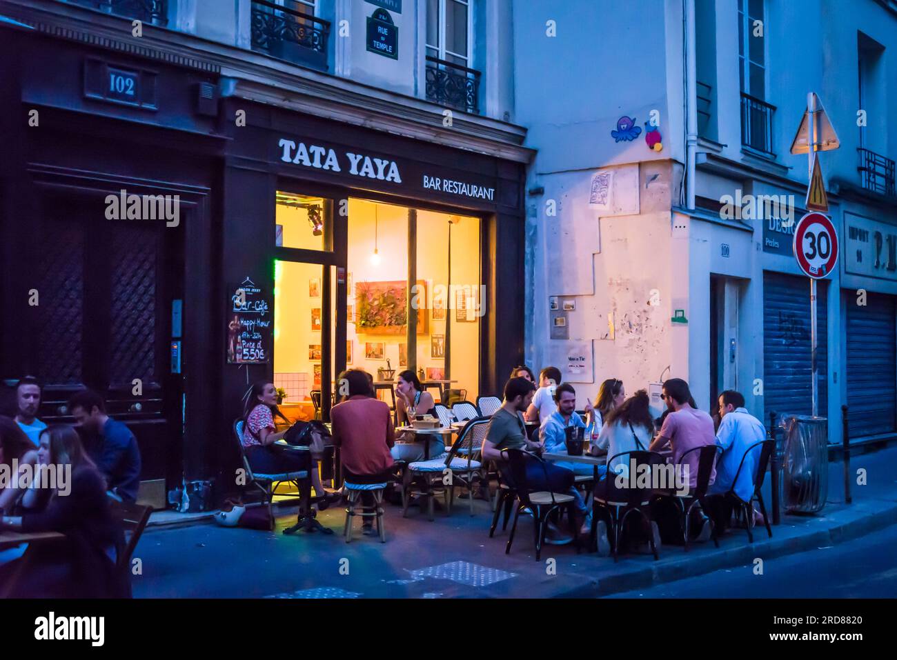 People sitting in an outdoor bar, Le Marais Neighborhood, Paris, France ...