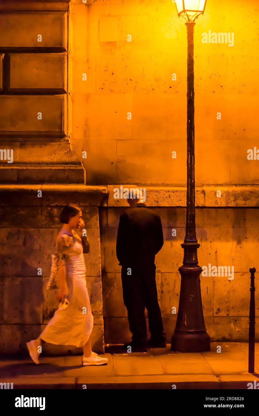 Man urinating in the street, Le Marais Neighborhood, Paris, France ...